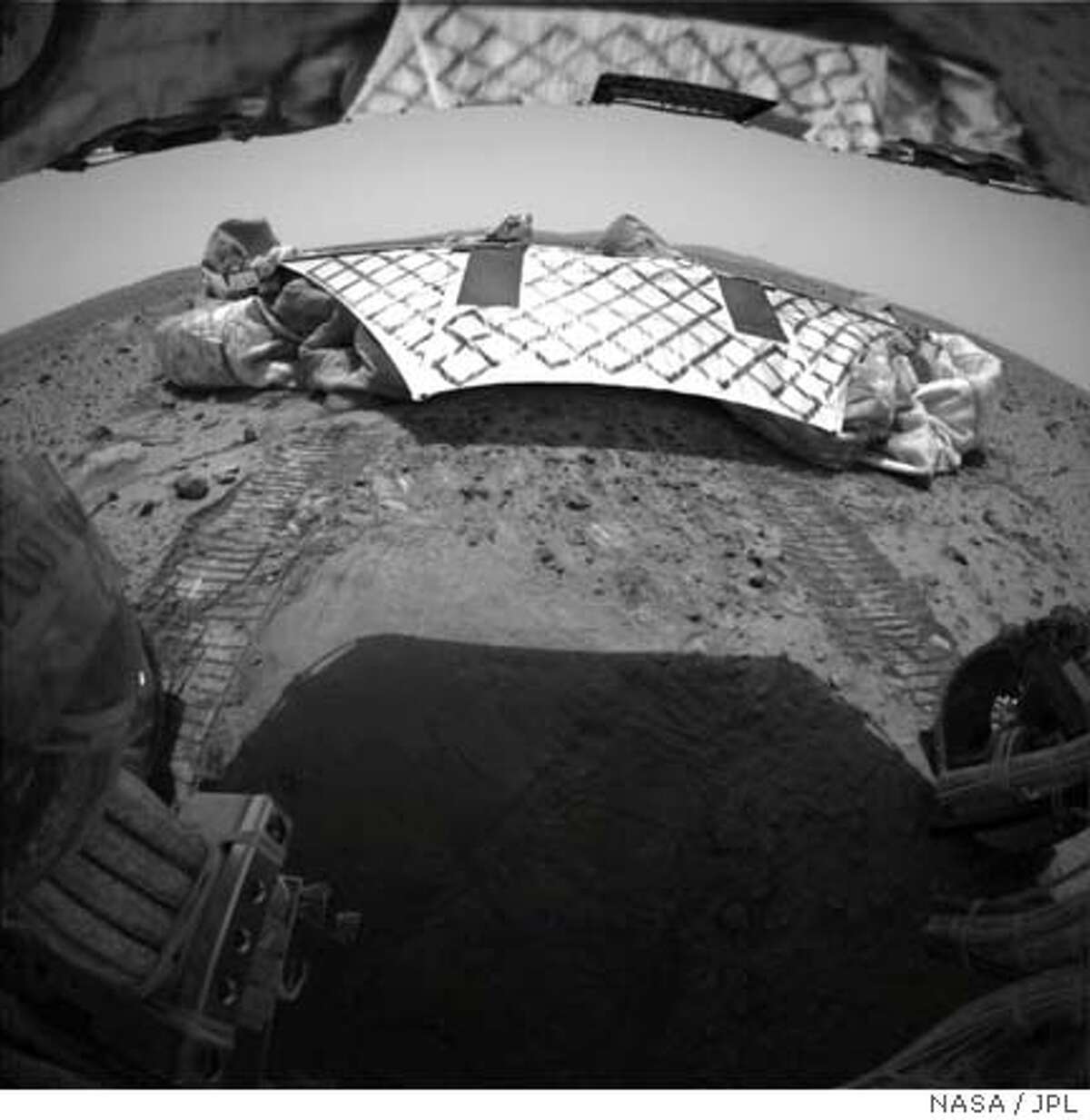 Spirit begins hunt for water signs / Scientists leap for joy as rover ...