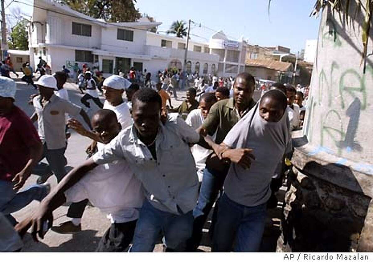 Gunmen kill 5 in attack on marchers in Haiti / Marines fire back, their ...