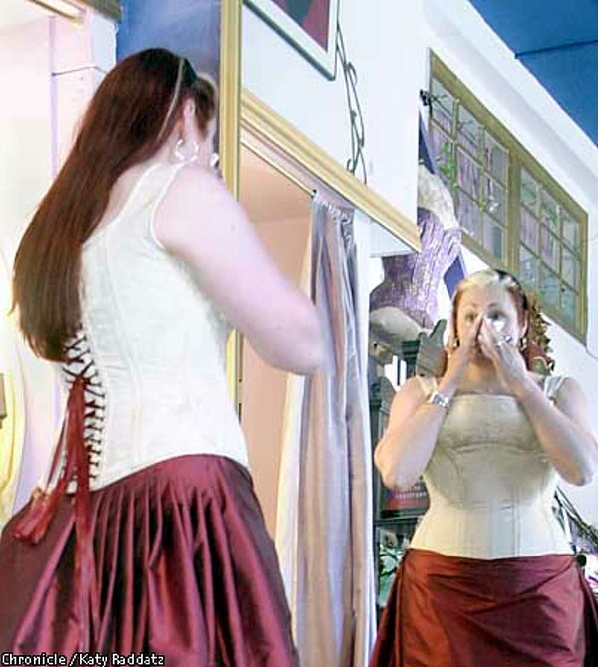 The ties that bind / A custom corset, gown contribute to fabric of an S ...