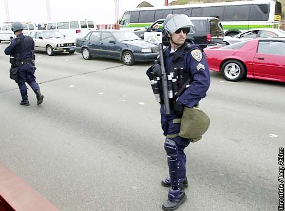 Anti-war rally ties up bridge / Cops stop traffic to make arrests at ...