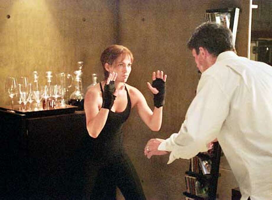 Obsession hot and cold / Lopez keeps tension at fever pitch in 'Enough ...