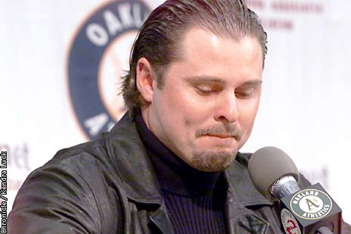 Money talks, Giambi walks / Slugger switches to pinstripes for $120
