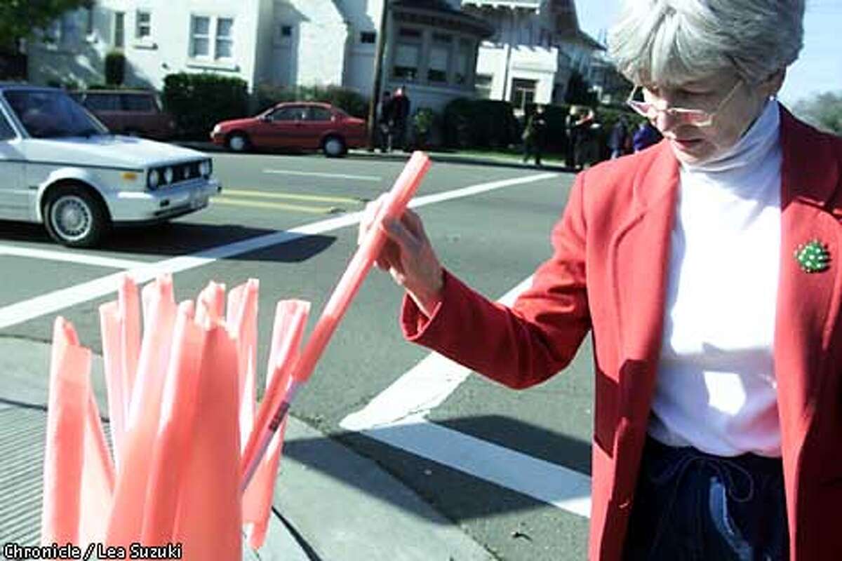 Berkeley flag-wavers / Pedestrians have new intersection safety devices