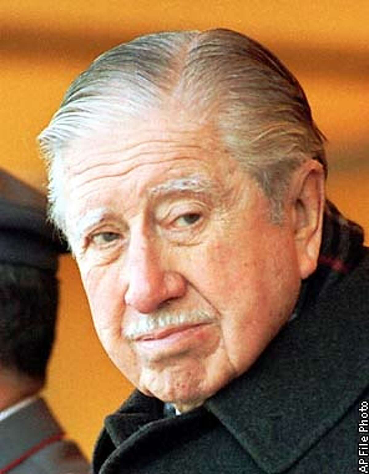 Kissinger on trial / Lawsuits are designed to expose his role in Chile ...