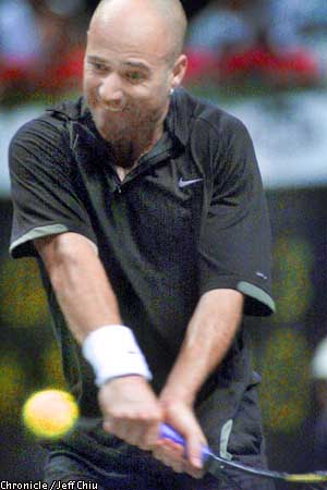 Sweating it out / Agassi advances after dropping 1st set to qualifier