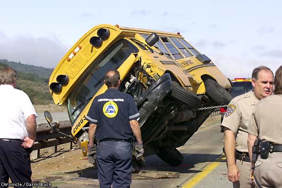 School bus destroys CHP car