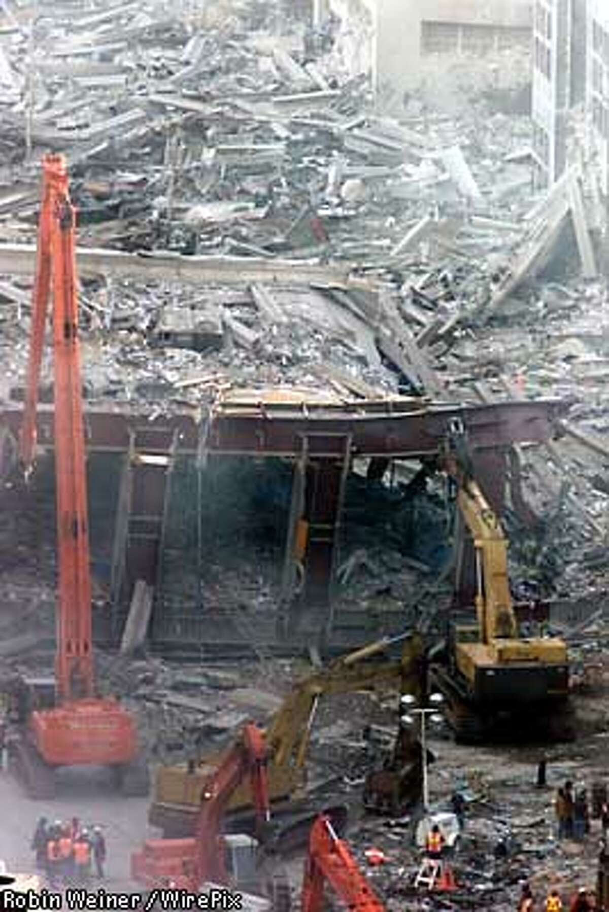 THE AFTERMATH / Daunting rise and fall of towers / Cleaning up debris ...