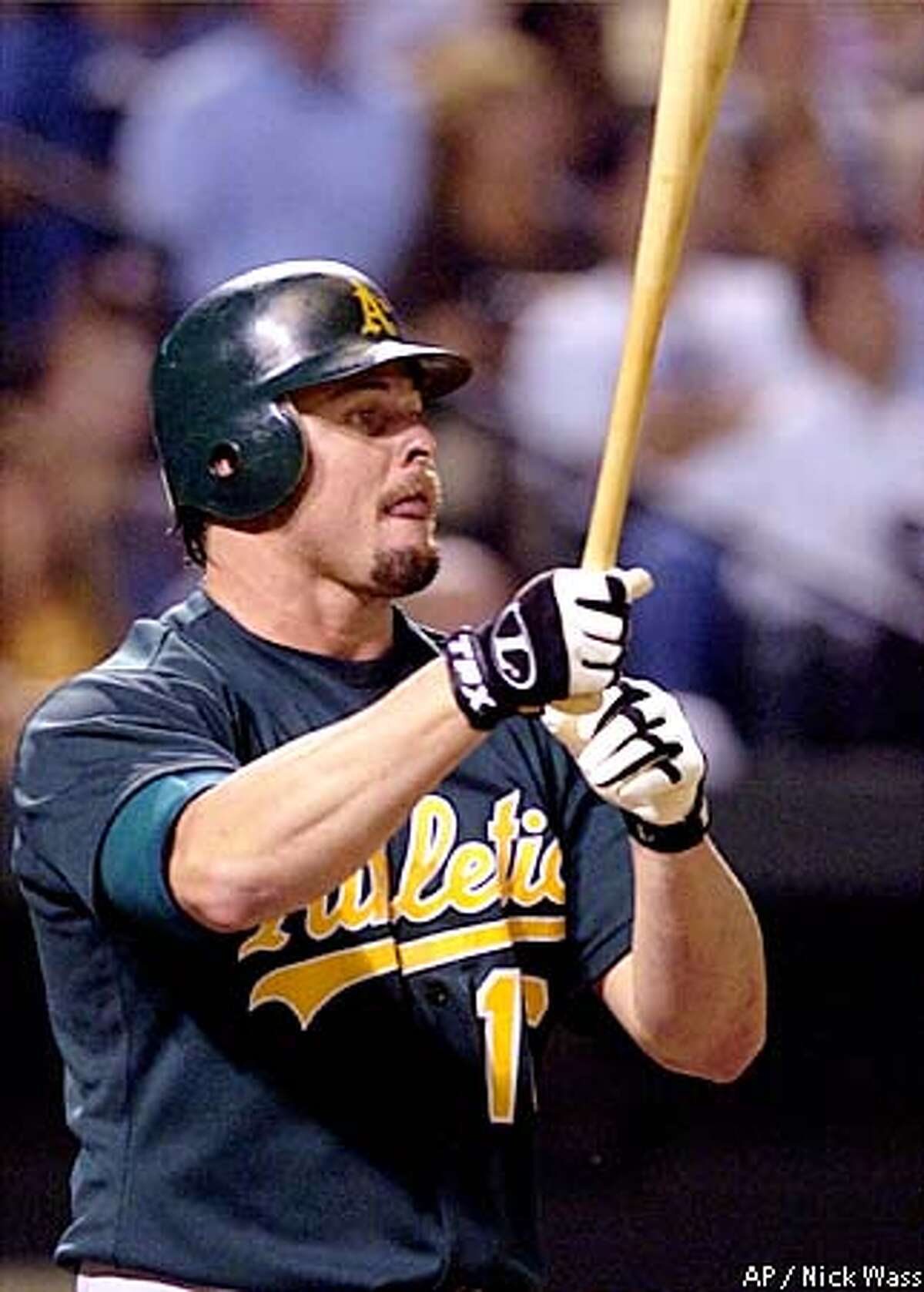 Giambi reaches 100-RBI mark / Red-hot Giambi sparks A's again