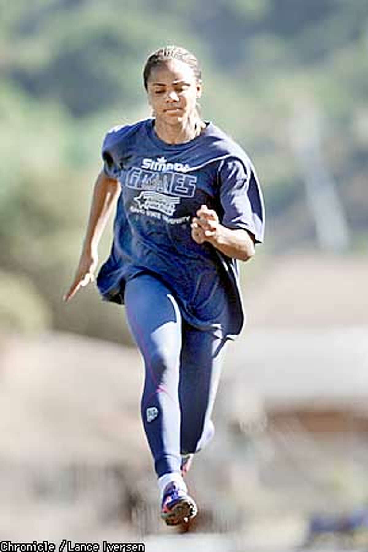 SPORTS / Runner back on track / After hiatus, Oakland's Tania Woods ...
