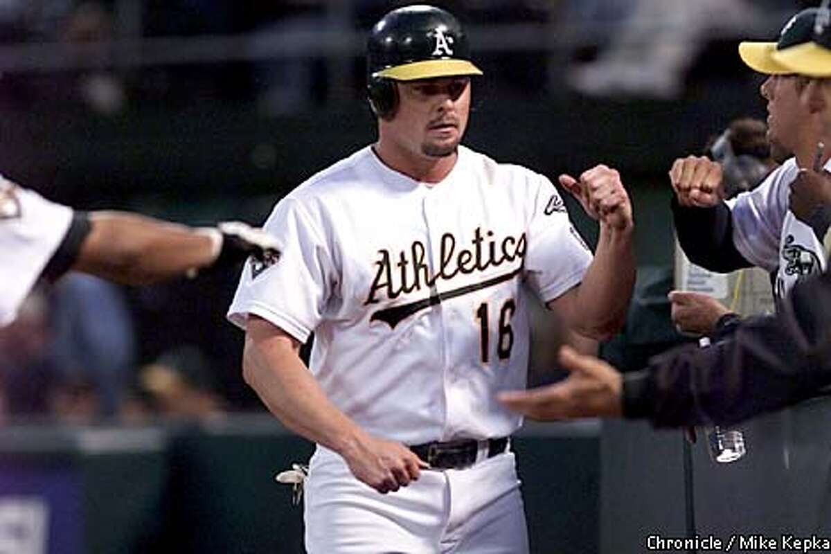 A's, Giants bust out / Father's hitting lesson awakens Giambi's bat