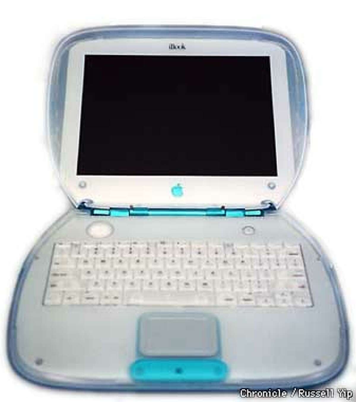 Checking Out Apple's New iBook / Apple's new laptop is a pleasure to ...