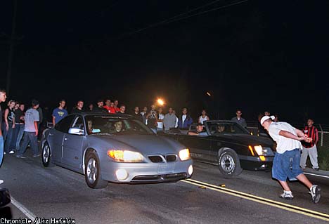 Revved-up renegades / Hundreds of street racers line up to defy threats ...