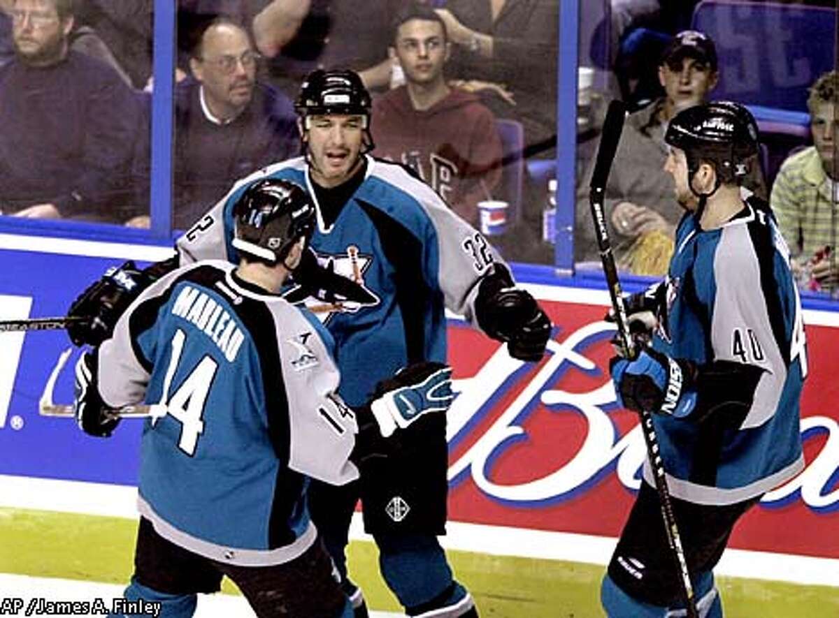 Overtime goal sinks San Jose / Slap in Sharks' face / Long-distance ...