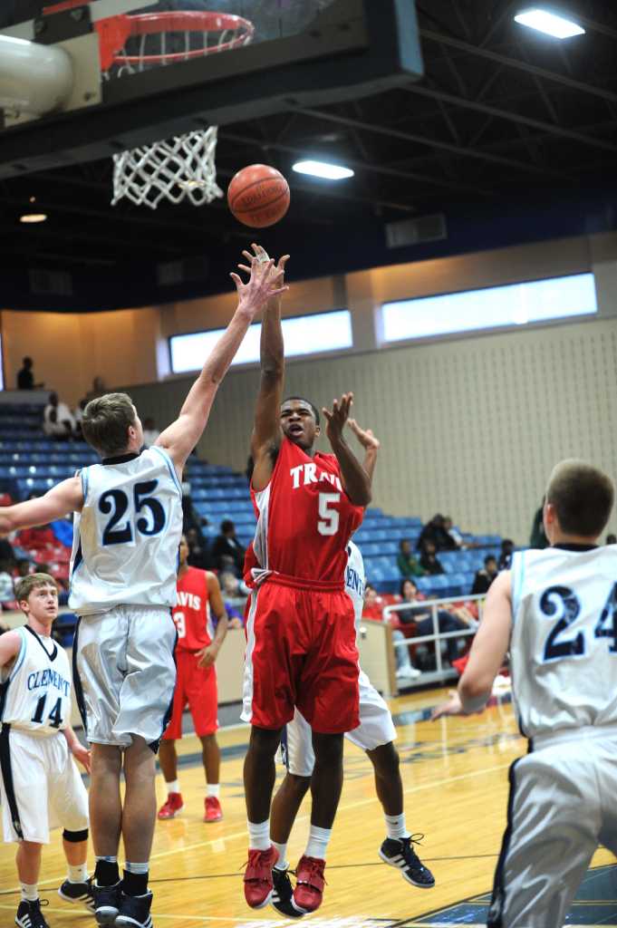 Boys basketball: Travis to playoffs on roll