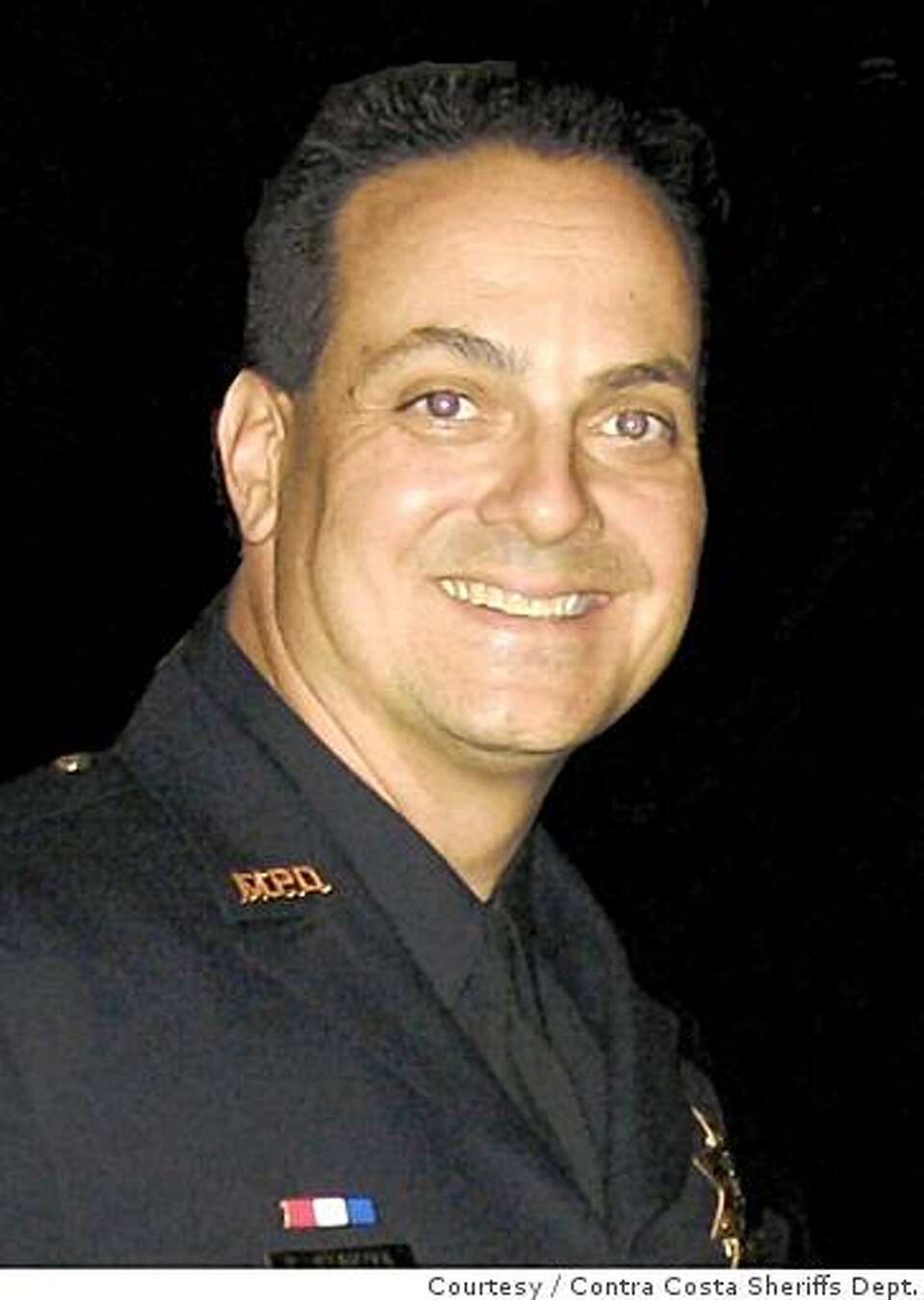 Martinez cop died trying to save 6 captives
