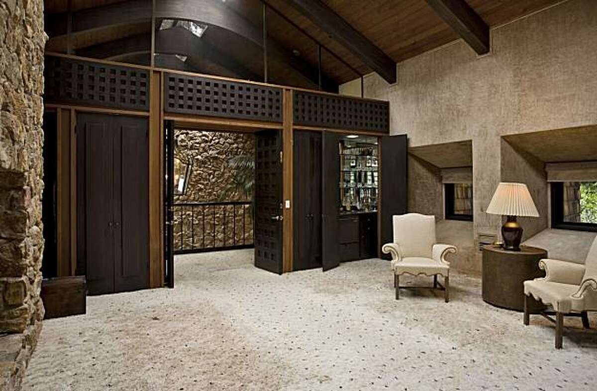 Tropical landscape, stone interior shelter Piedmont home