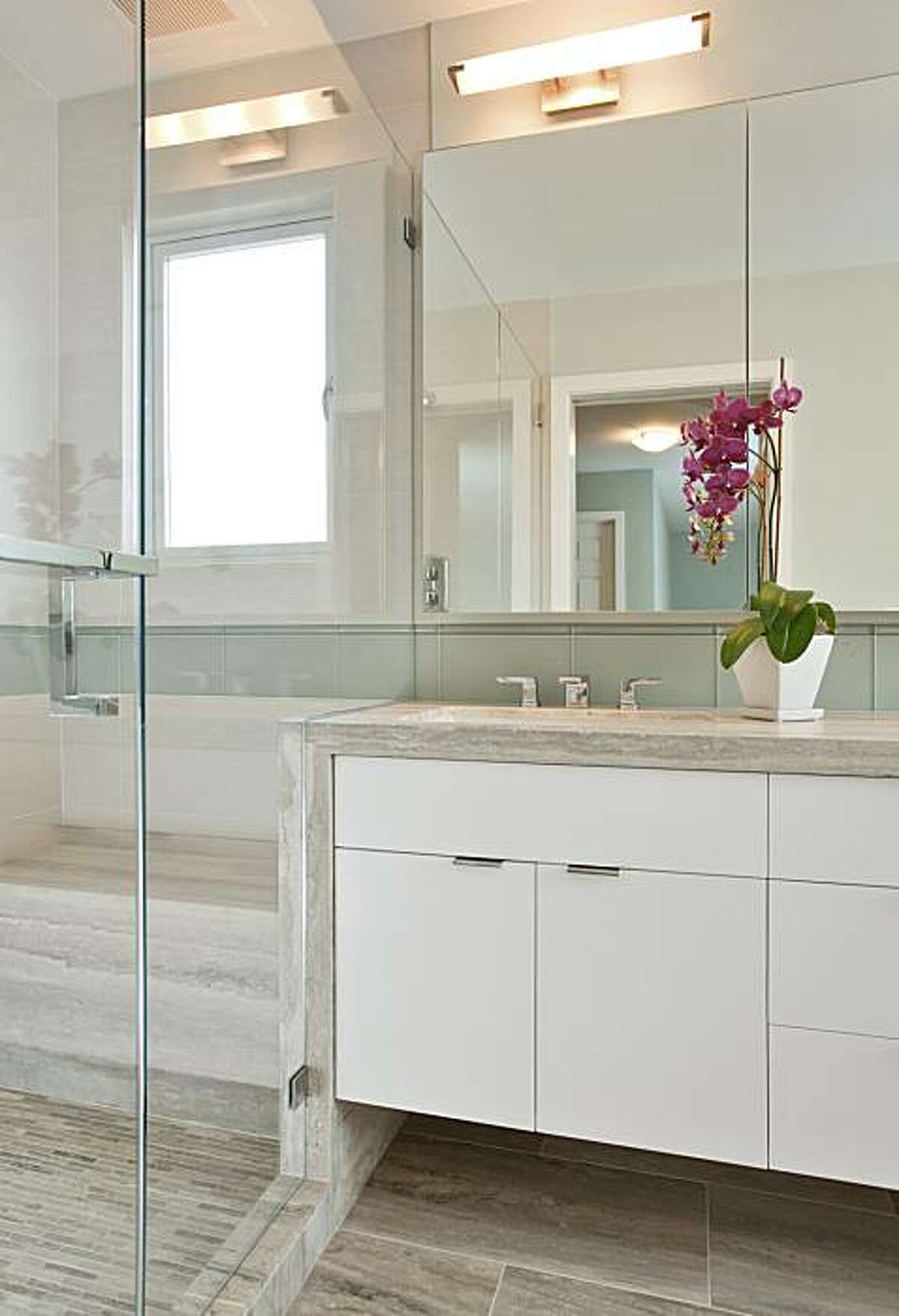Smart layout cleans up the look of master bathrooms