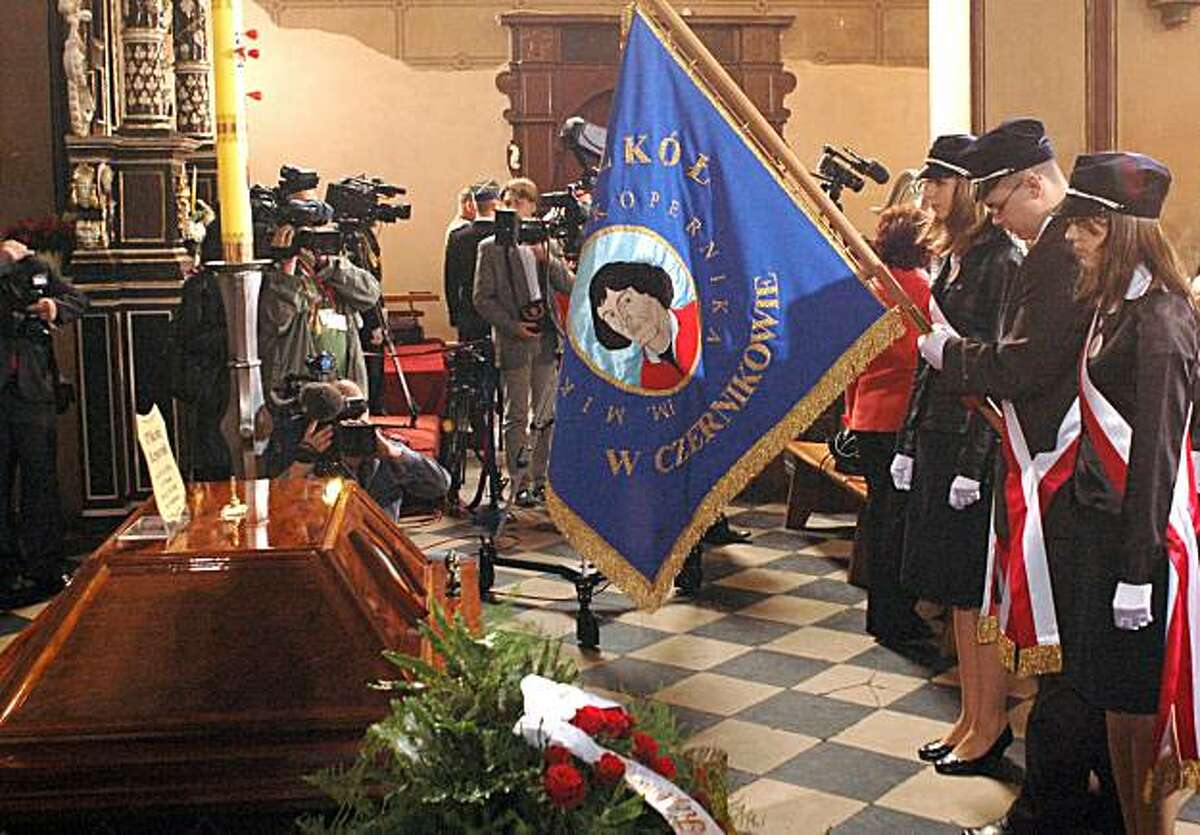 Once reviled, Copernicus reburied as church hero