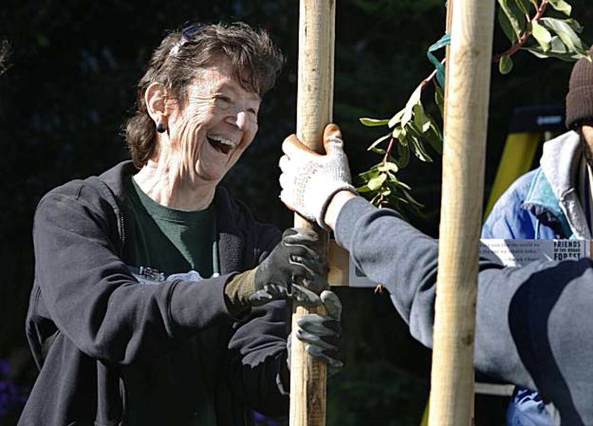 Couple plant trees for exercise, environment