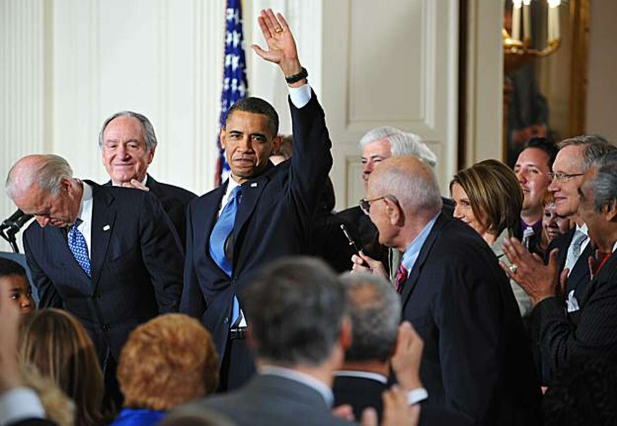 Obama signs health care reform into law