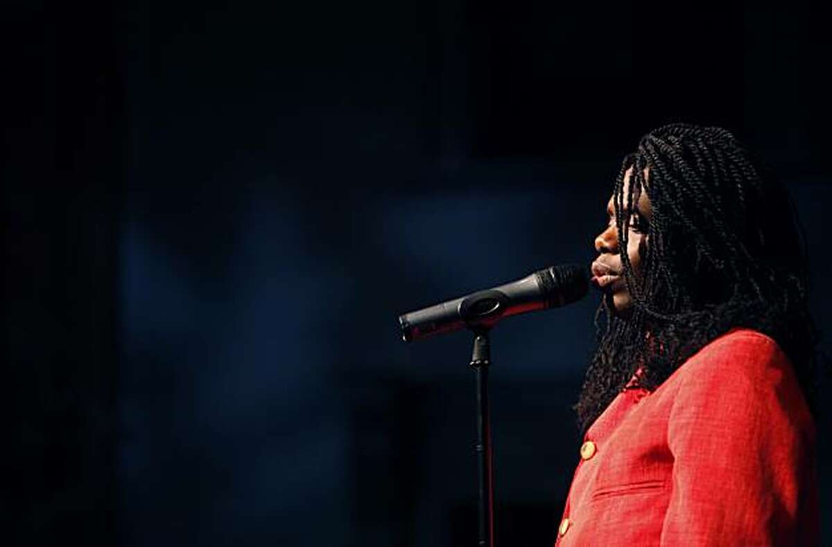 Amy Tan gives singer Pascal Toussaint a hand