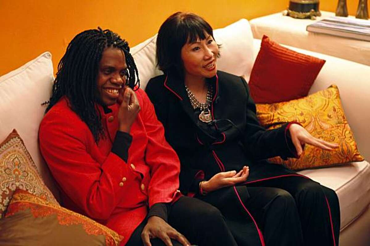 Amy Tan gives singer Pascal Toussaint a hand