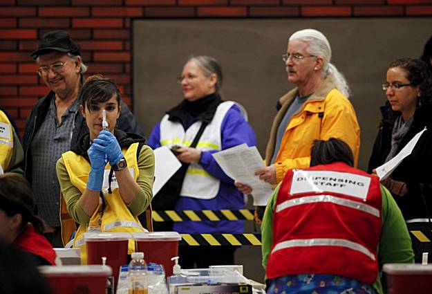 Giving shots to masses at inoculation station