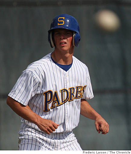 Teen ballplayer tips cap to BALCO trainer