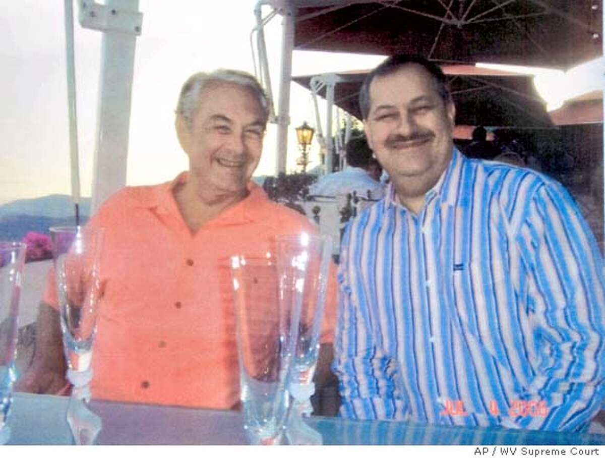 Judge recuses self as photos of him with executive come out