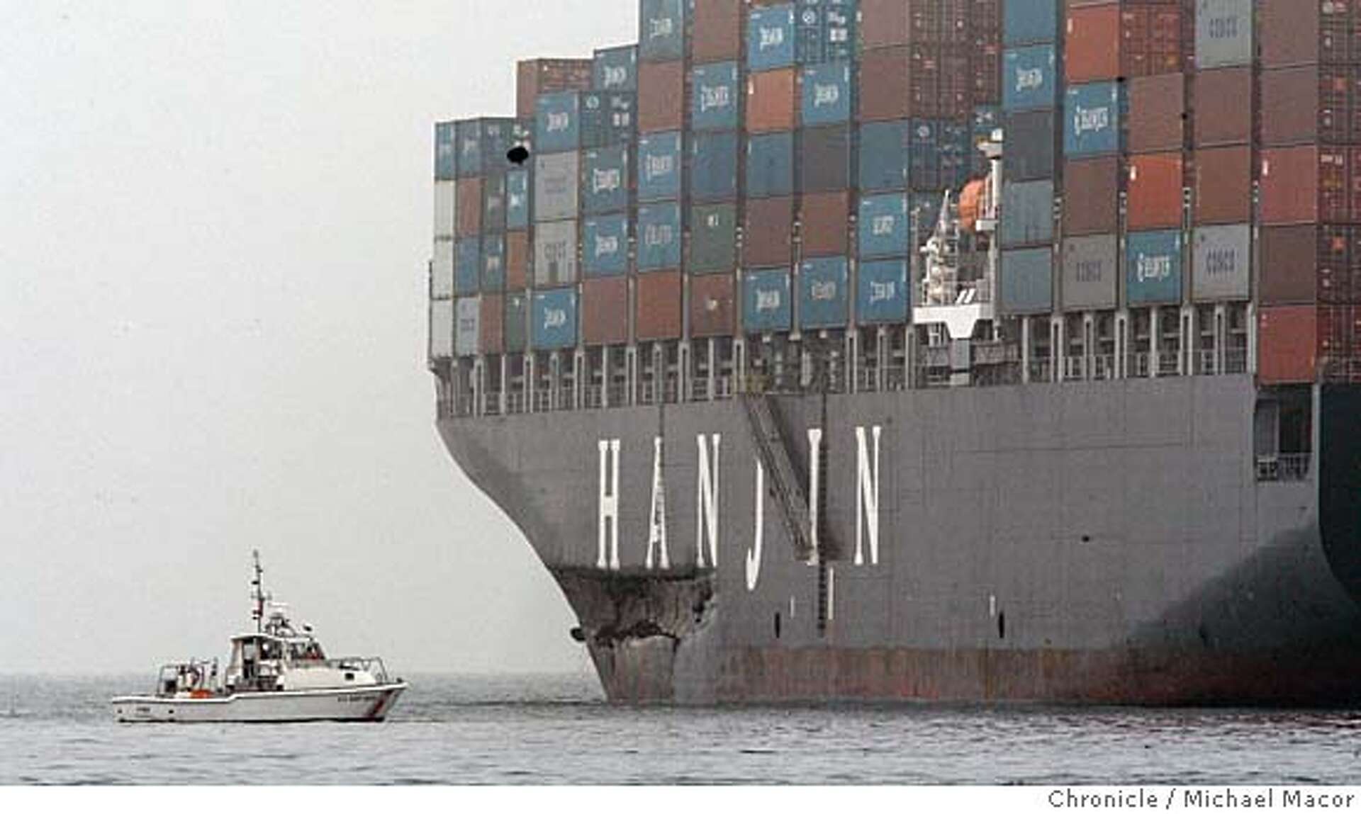 Container ship hits Bay Bridge tower - fuel spills, but span undamaged