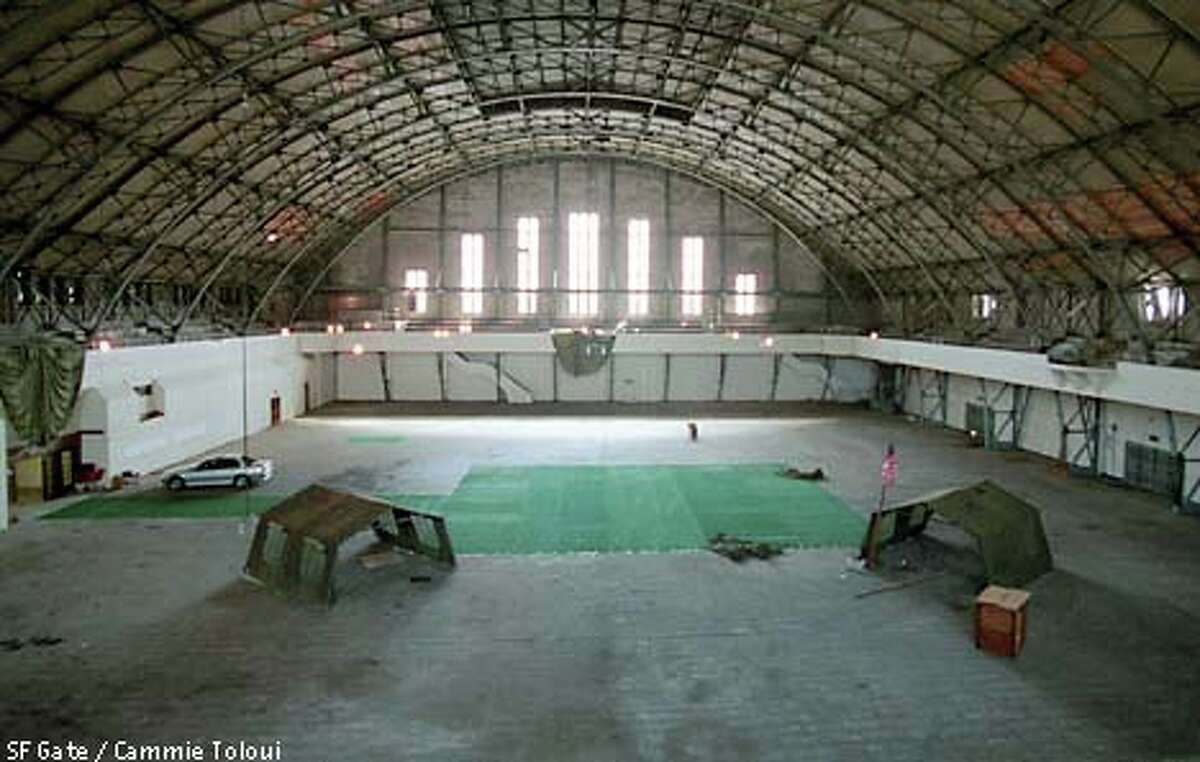 Inside the Belly of the Building / Behind the Armory's deformed brick ...