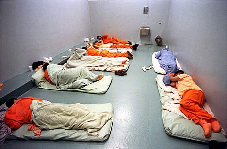 Inmates sleep on floors in overflowing cell blocks