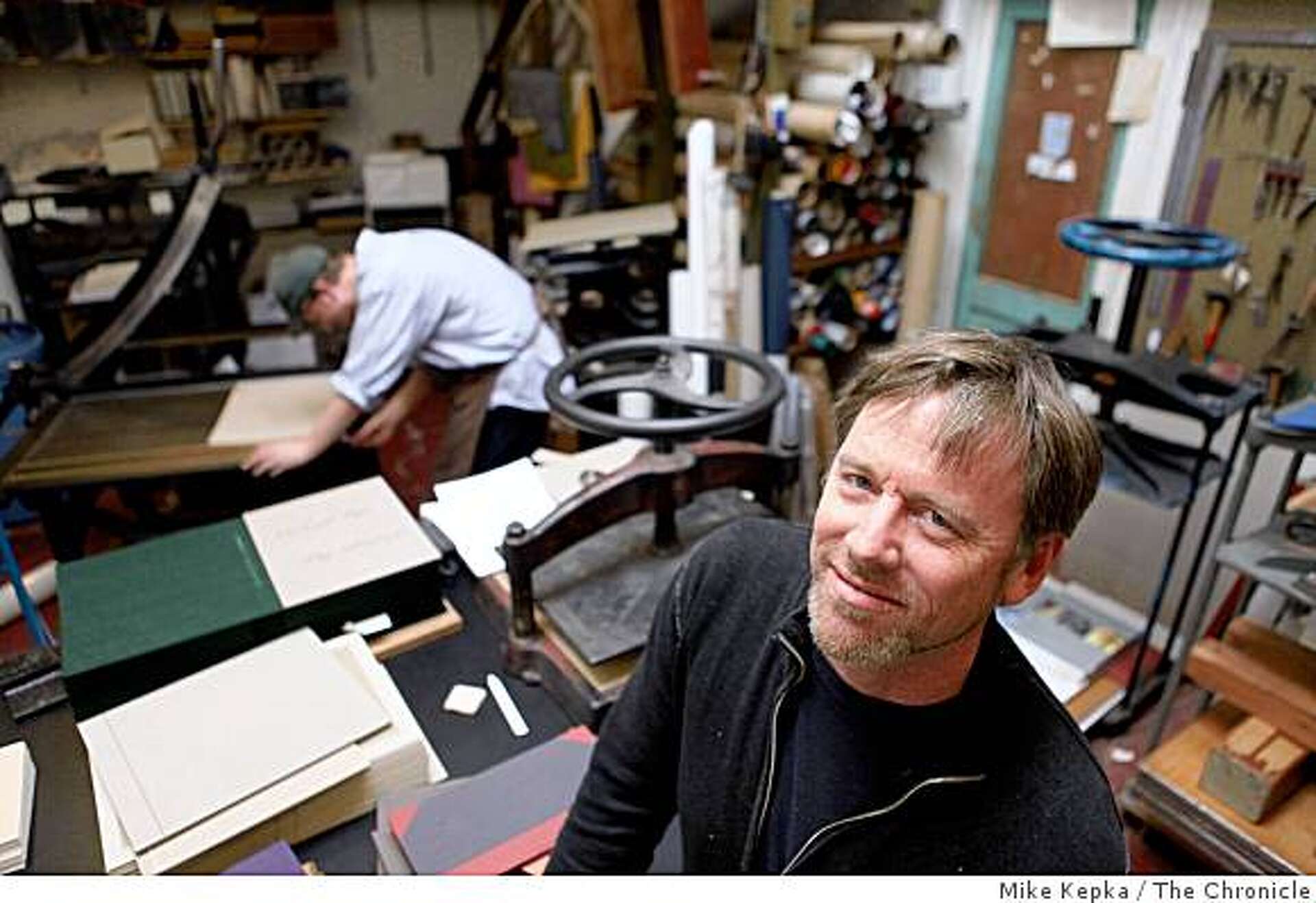 Bookbinder uses 19th century tools