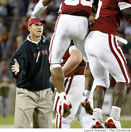 Harbaugh says he's committed