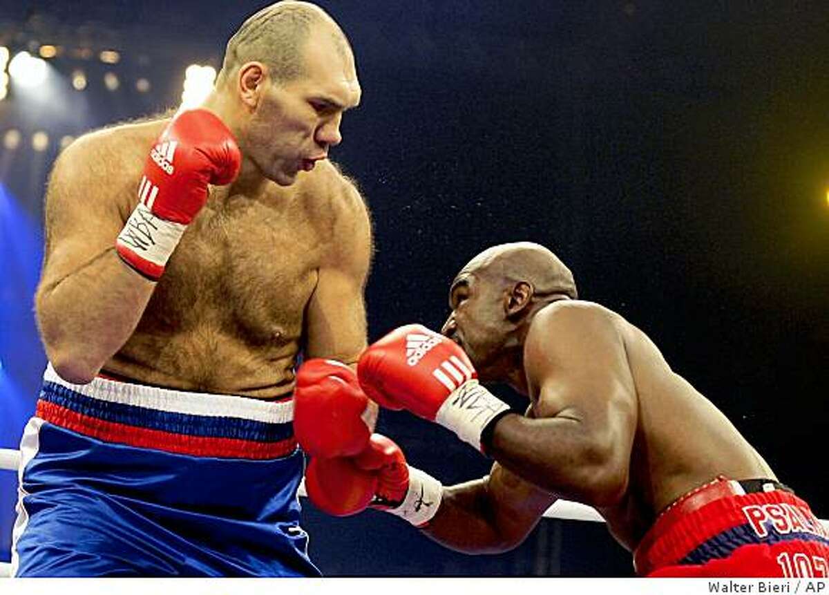 Holyfield can't chop down Russian giant