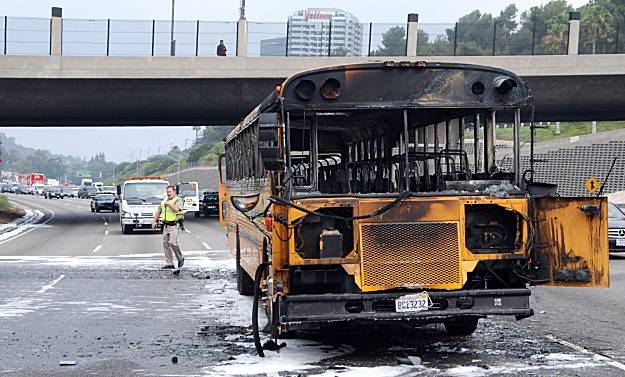 Motorists help students escape burning bus