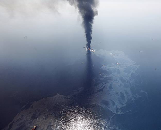 Burning oil rig sinks - major spill feared
