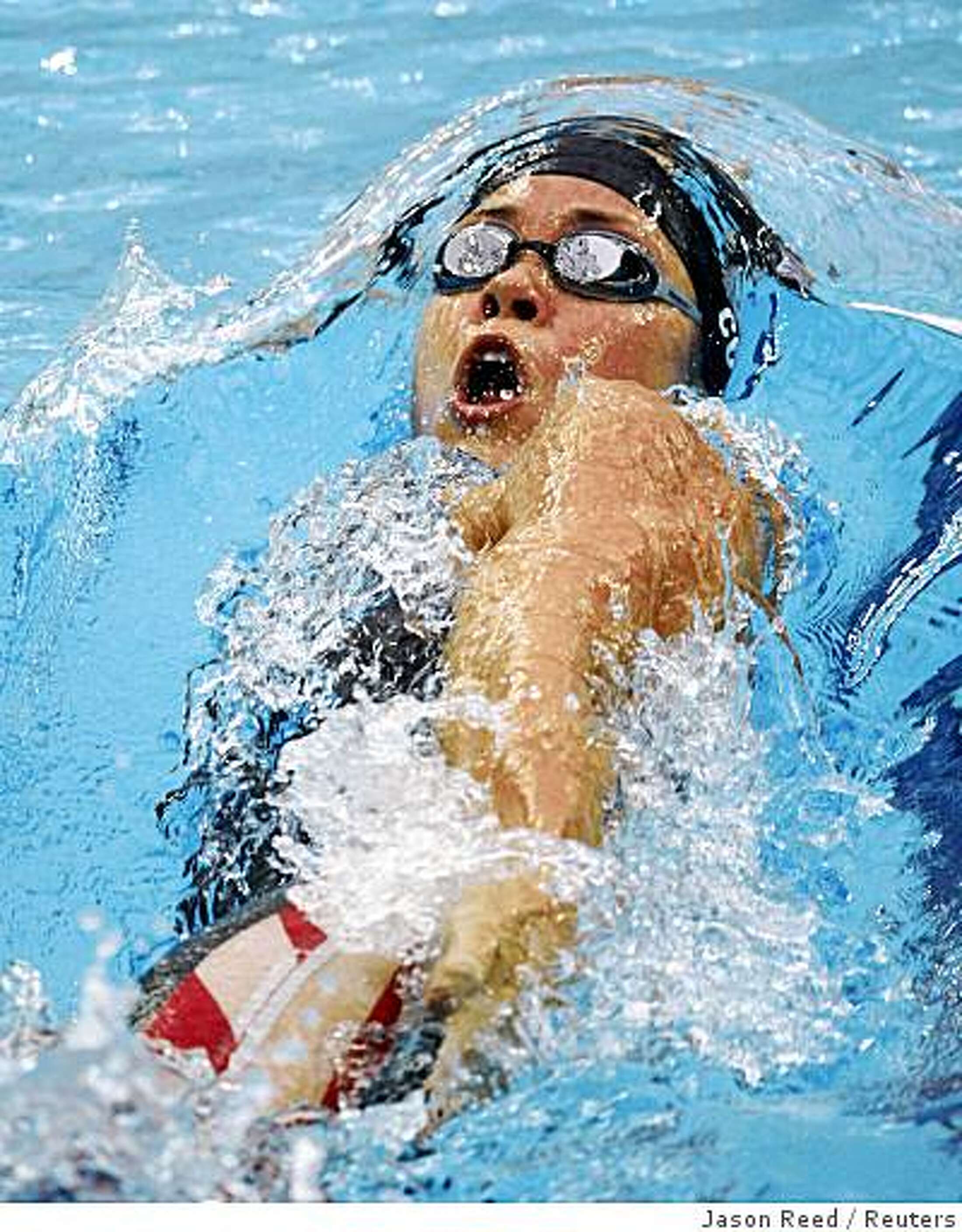 COUGHLIN: 1st woman to repeat in 100 back