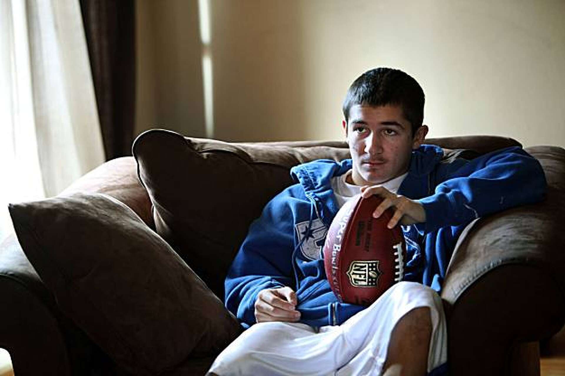 Teen upbeat after near-fatal football injury