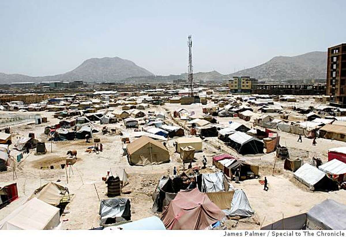 Returning Afghans survive in tent camps