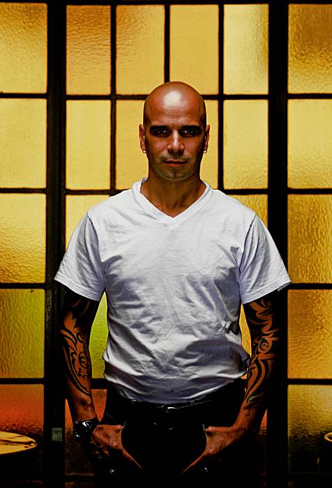 Chef/owner of Aziza wears his past on his skin