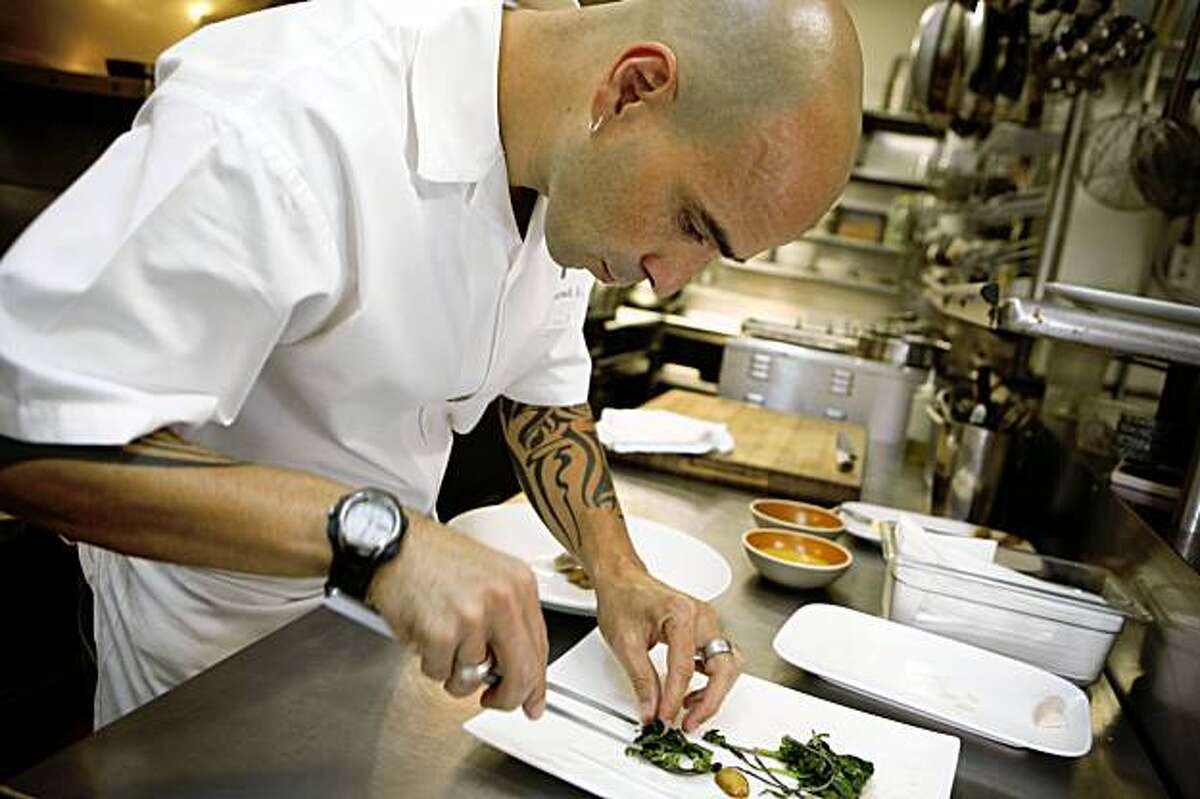 Chef/owner of Aziza wears his past on his skin