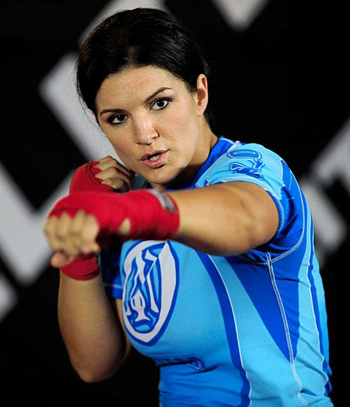 Carano's a knockout inside the ring first