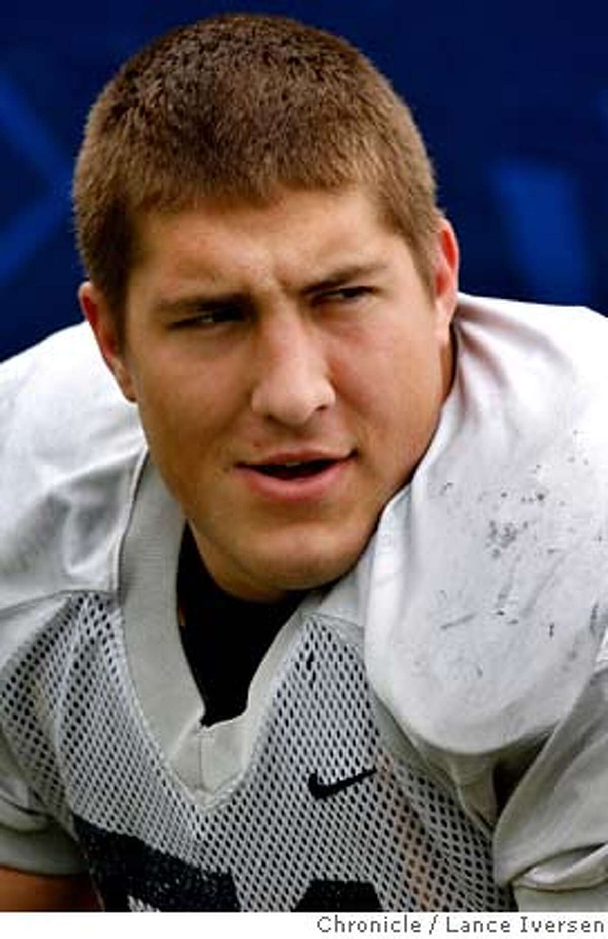 Mack staying in school