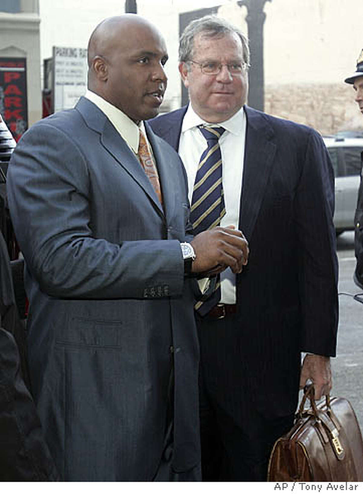 Bonds wants to keep his lawyers, conflicts or no