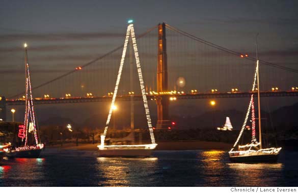 A holiday parade with boats on the bay