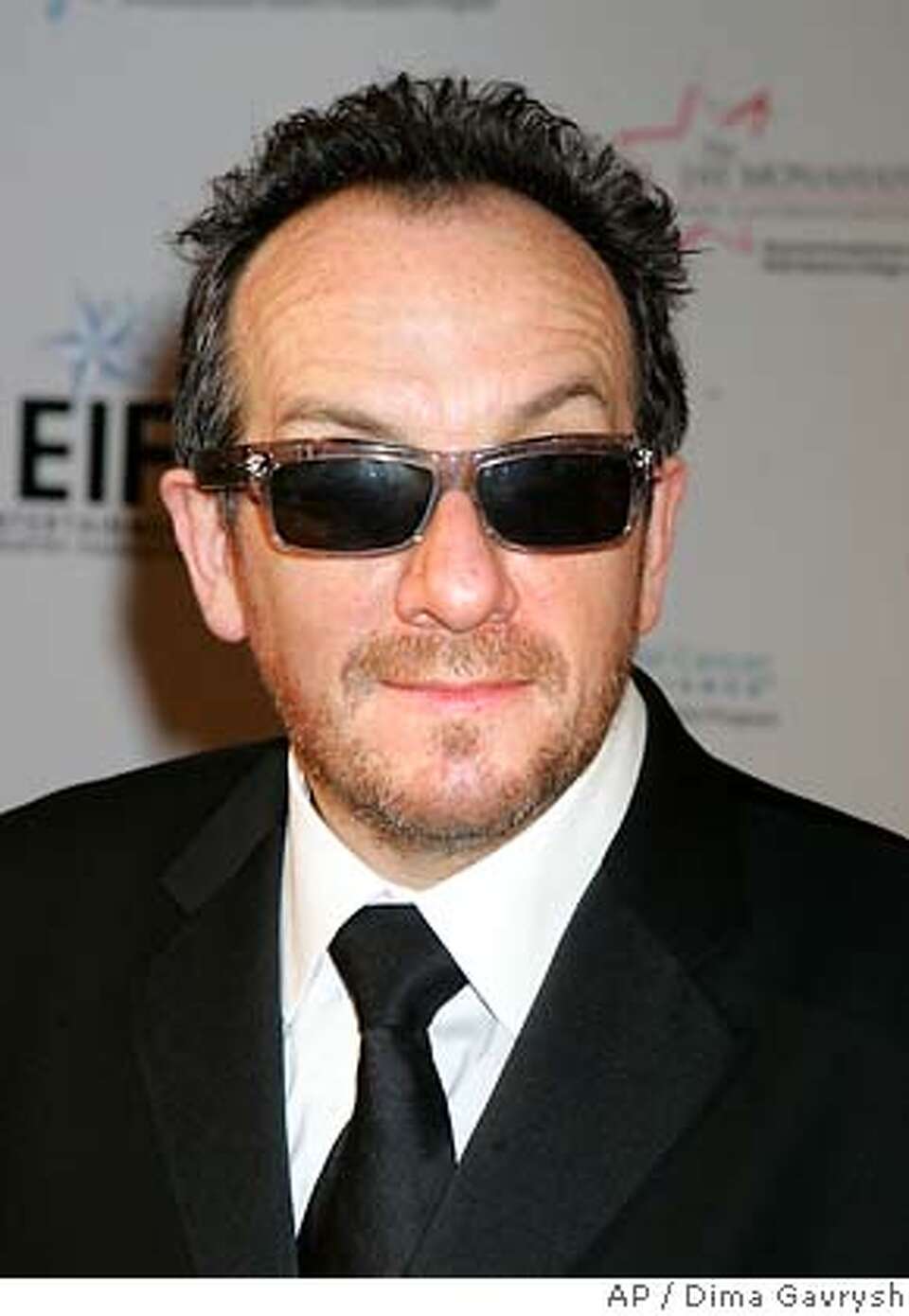 Costello, band regroup for good cause