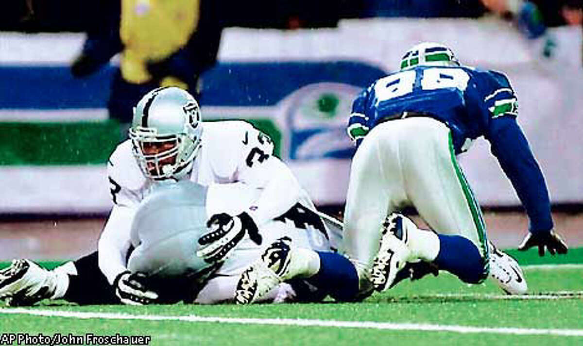 Bizarre Play Stuns Raiders / Controversial safety allows Seattle to rally