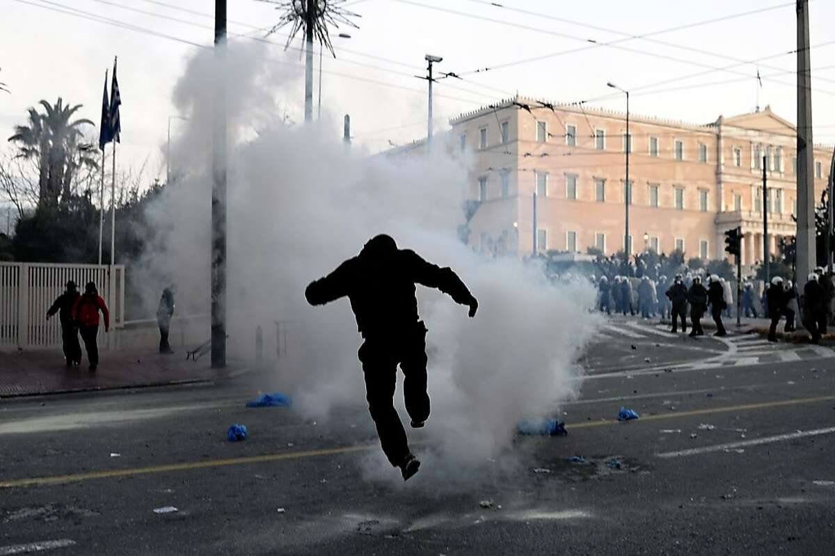 Greece passes rescue package amid violent protests