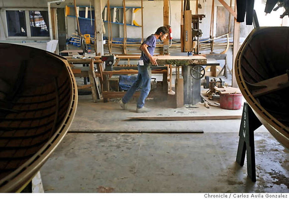 Building boats the way they used to / Group of young carpenters turn ...